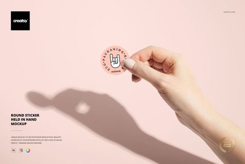 Round Sticker Held in Hand Mockup | Creatsy®