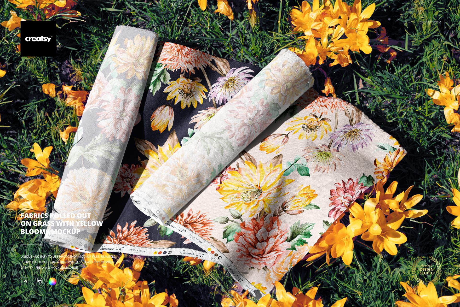 Fabrics Rolled Out on Grass with Yellow Blooms Mockup | Creatsy®